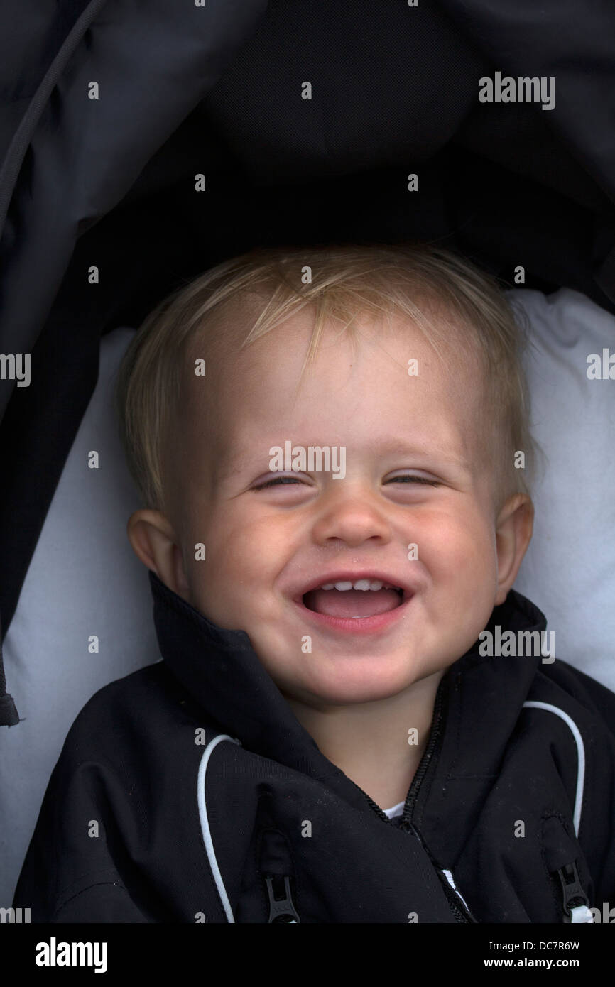 A toddler is happy in his pram Stock Photo - Alamy