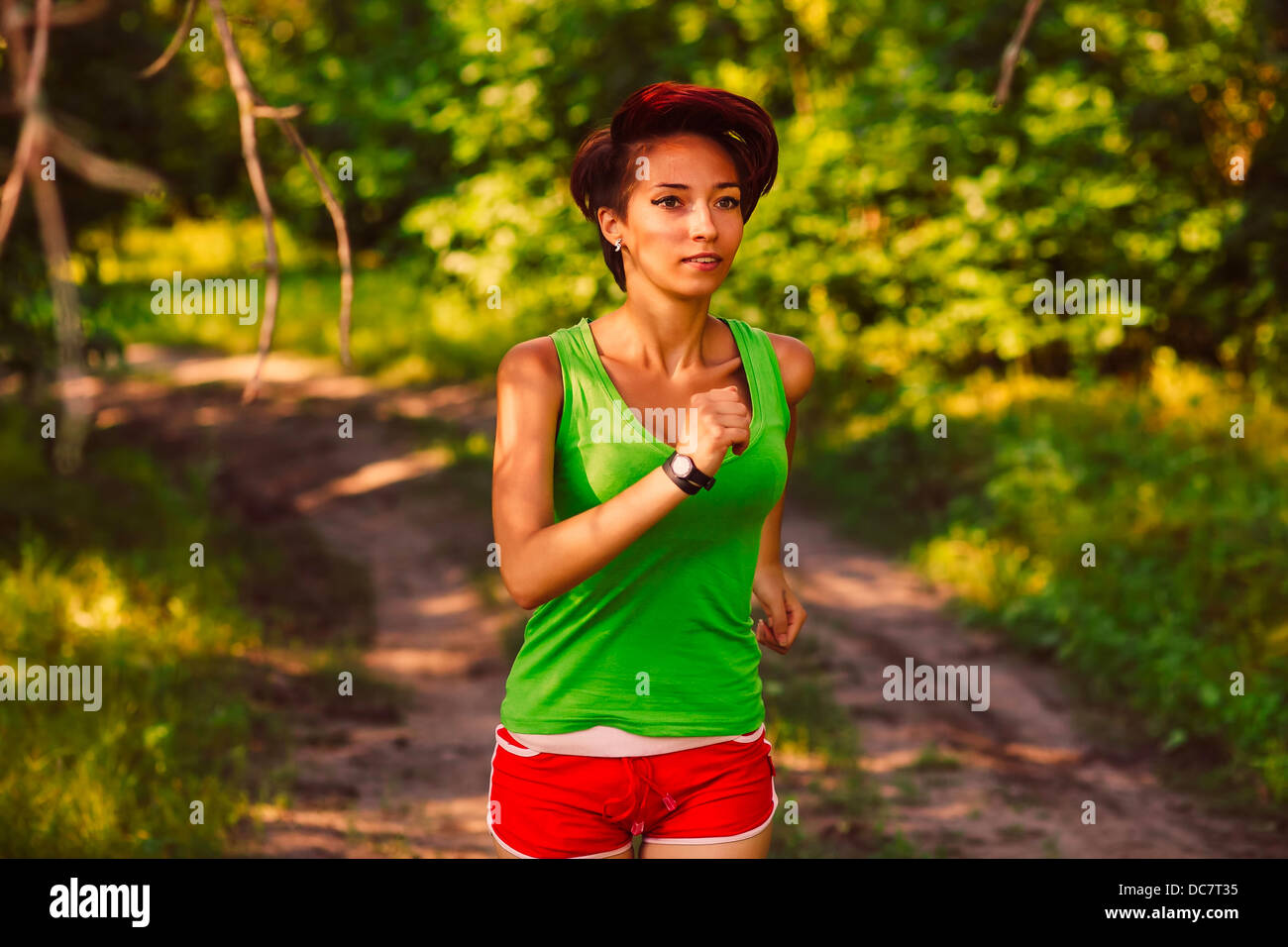 beautiful healthy runs young brunette woman athlete running a outdoors ...