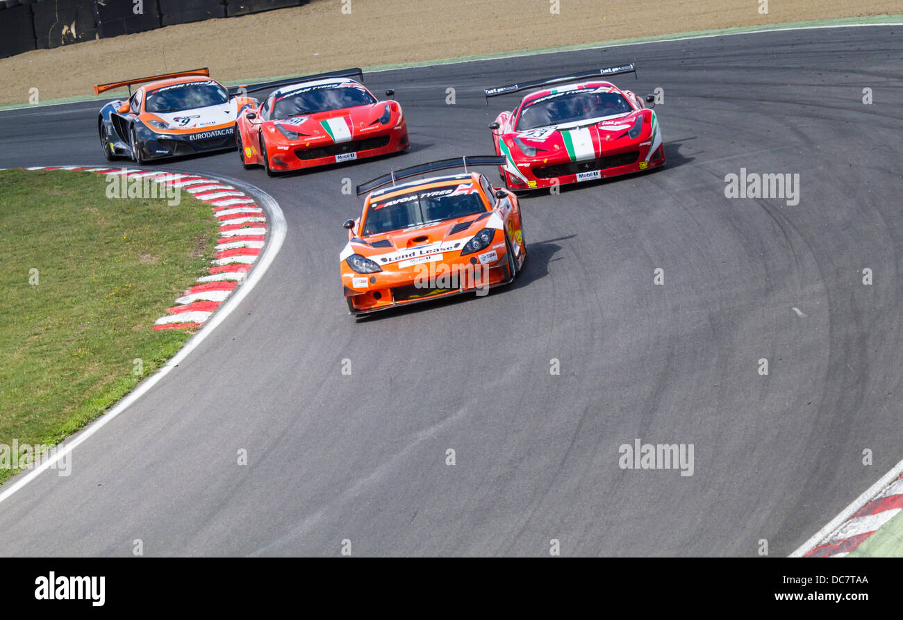 BritishGT race cars heading down Paddock Hill bend at Brands Hatch in ...