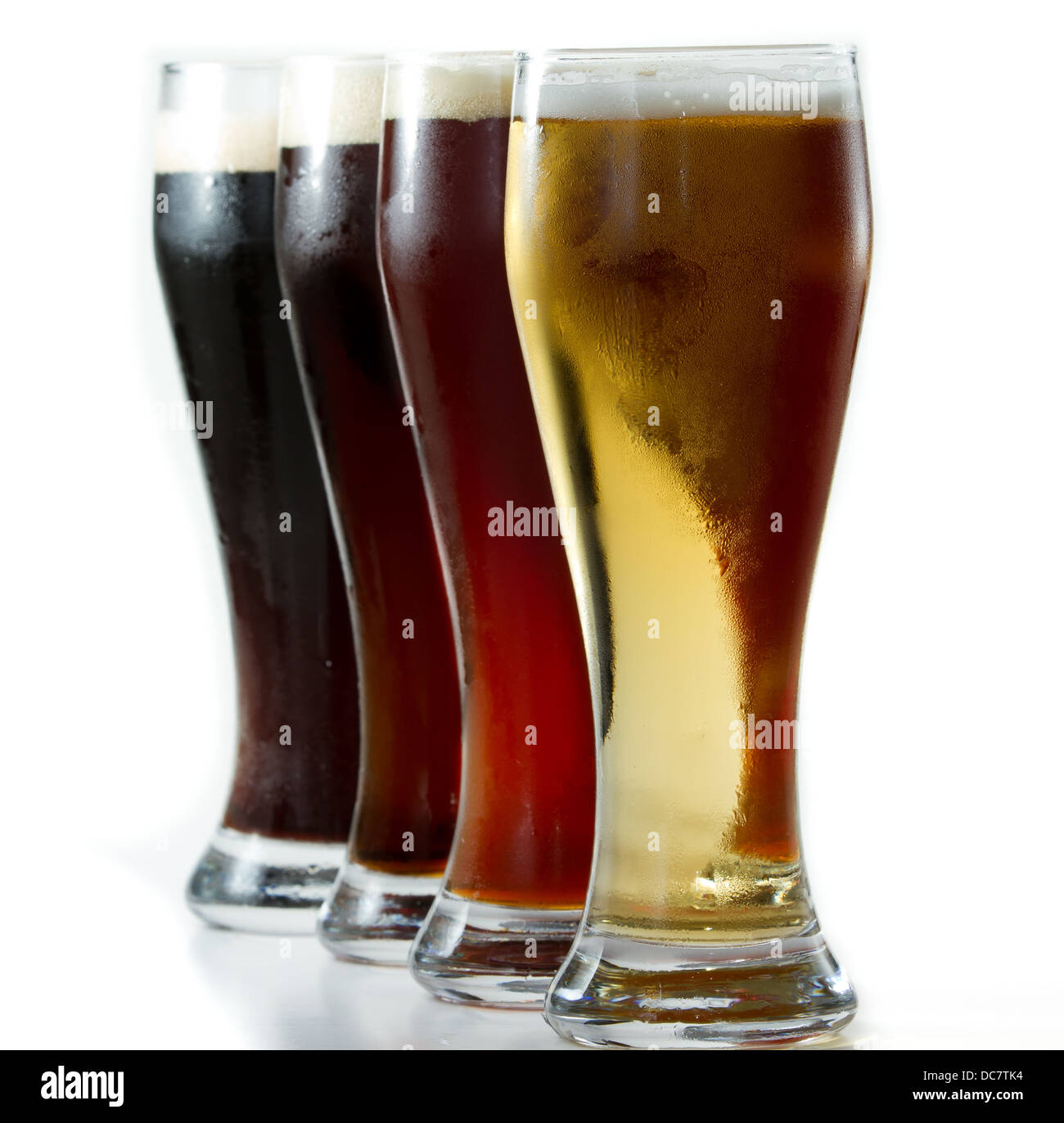 row of beers isolated on a white background from light to dark Stock ...