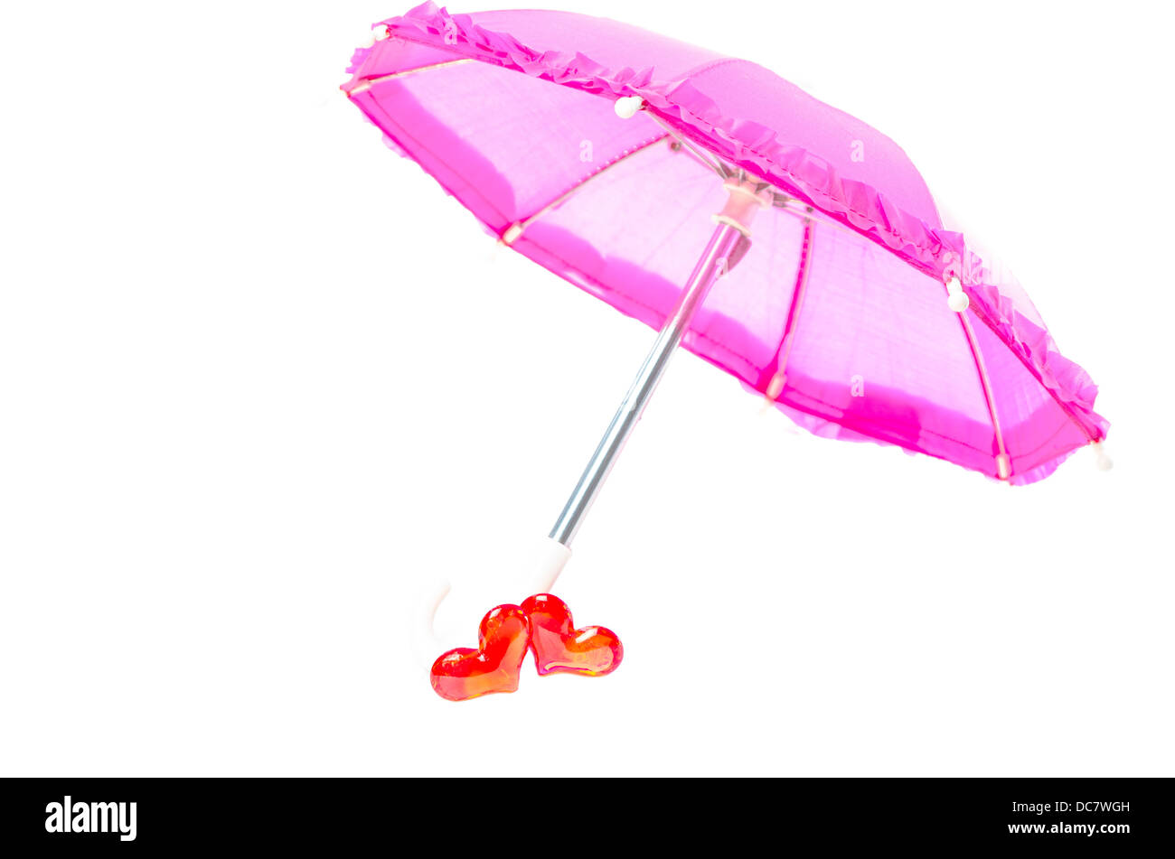 Pretty pink parasol with two decorative glossy red hearts Stock Photo ...
