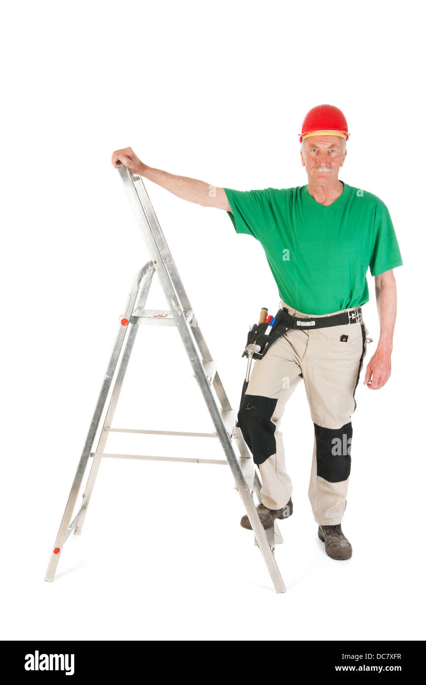 Senior man as manual worker with stepladder isolated over white ...