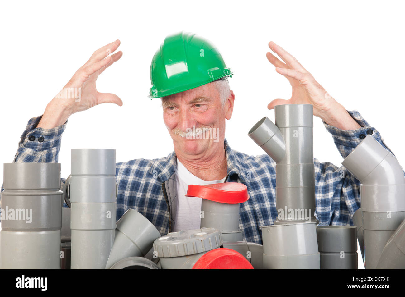 Plumber confused by assortment pvc tubes Stock Photo - Alamy