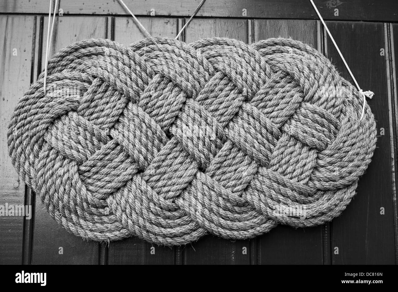 Ocean Plait knot used as a mat at entrance to boats Stock Photo - Alamy