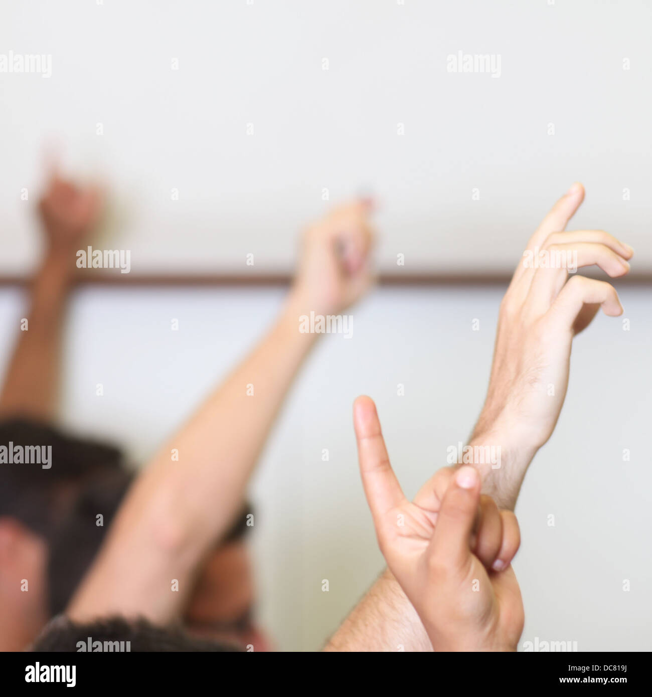 putting hands up Stock Photo - Alamy