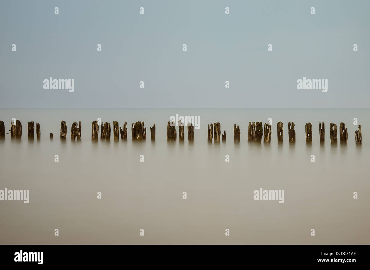 Long Exposure of piers at Erieau Beach in the summer Stock Photo - Alamy