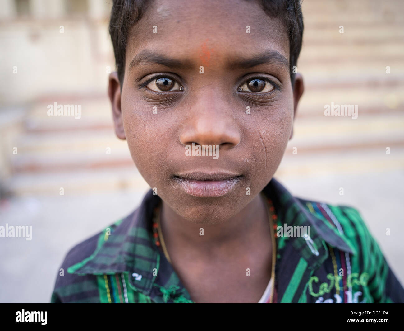 Young Indian boy playing on the street in Varanasi, India Stock Photo ...