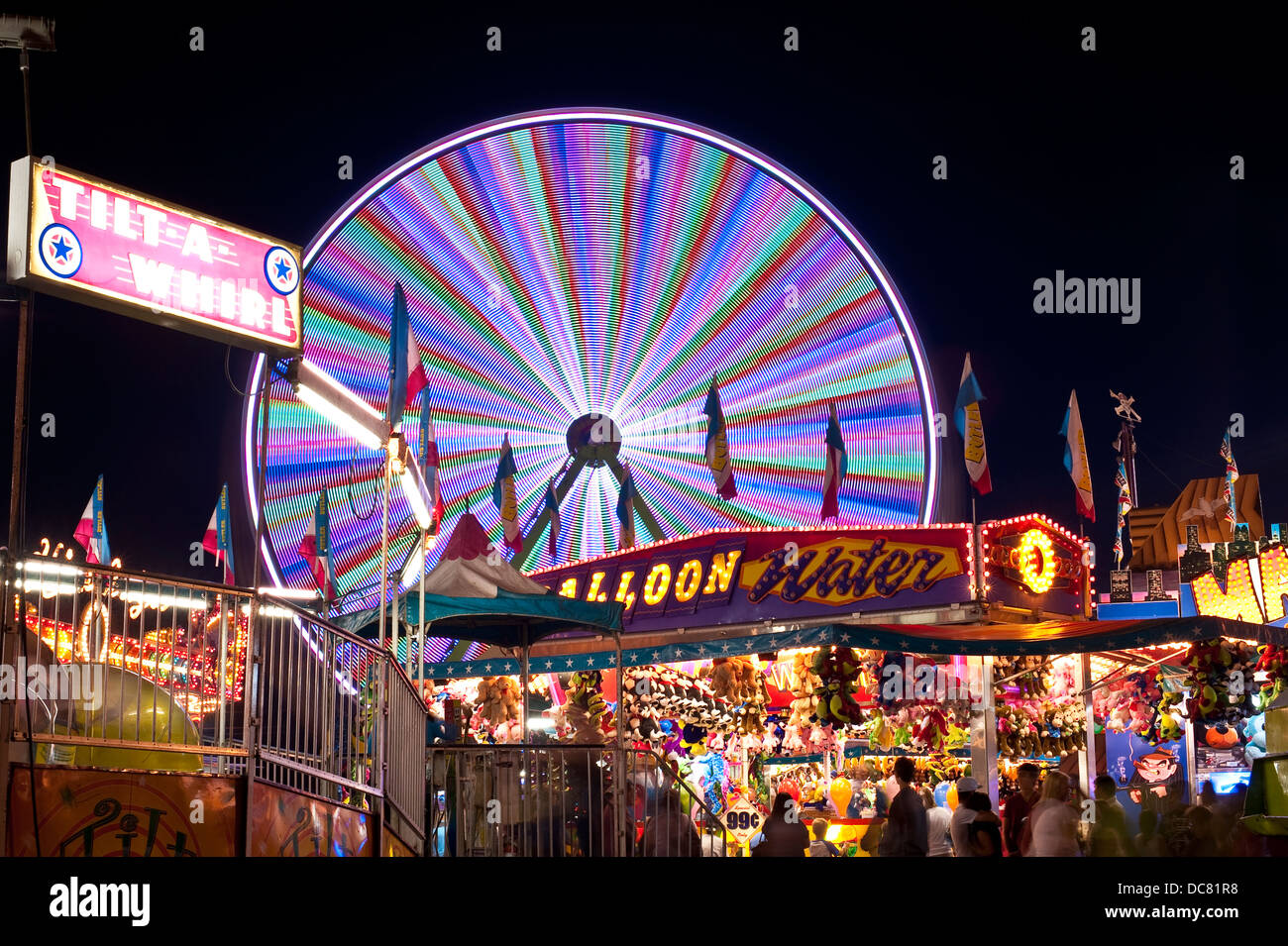 Ferris wheel and rides and booths at the Evergreen State Fair ...
