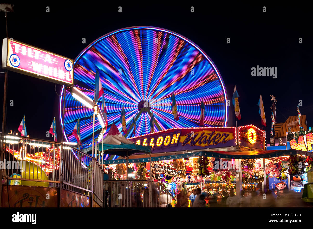 Ferris wheel and rides and booths at the Evergreen State Fair ...
