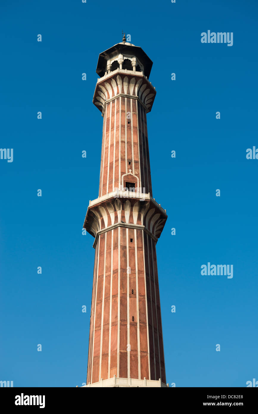 High minaret in Jama Masjid Mosque, Delhi, India with blue sky on ...
