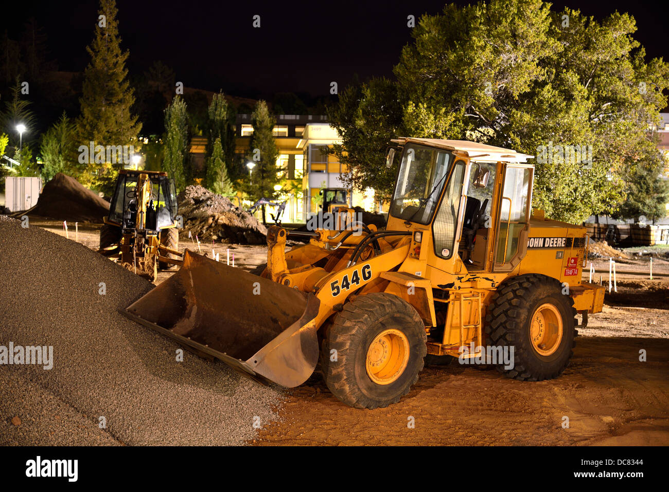 John Deere 544G wheel loader at night awaiting its construction crew ...