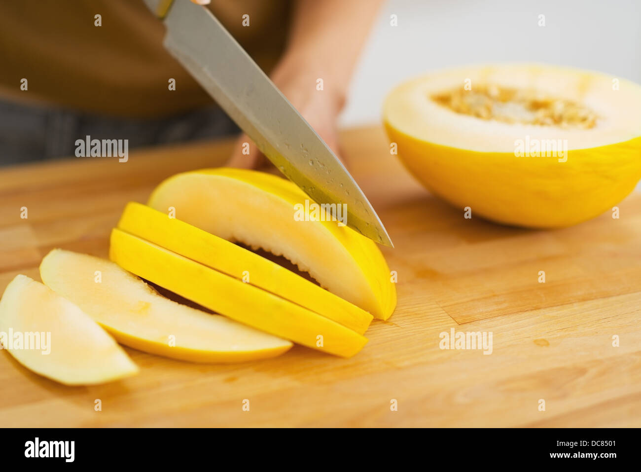 Woman cut melon hi-res stock photography and images - Alamy