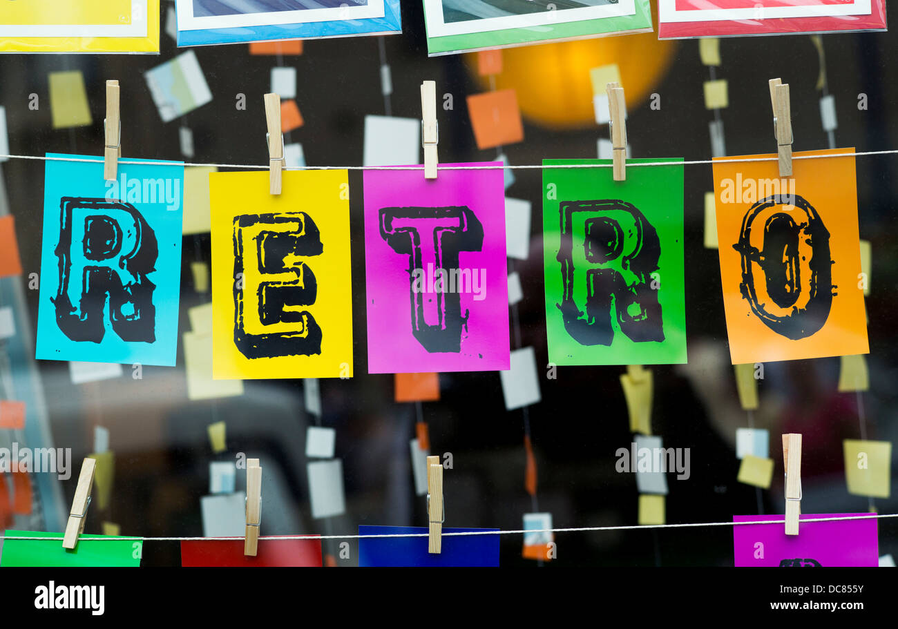 Colourful RETRO sign pegged on string in a shop window Stock Photo - Alamy
