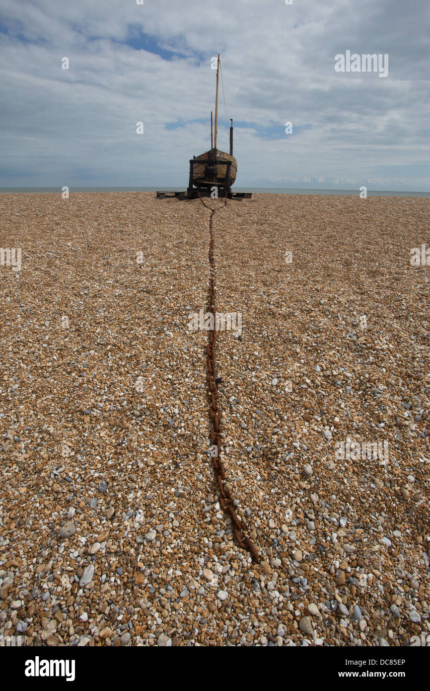 Pebble beach with boat hi-res stock photography and images - Alamy
