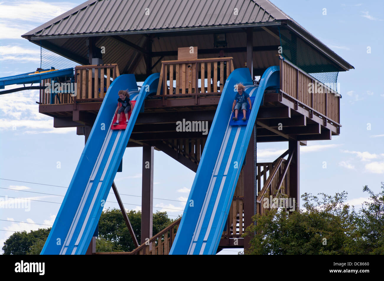 Children sliding down water slide hi-res stock photography and images ...