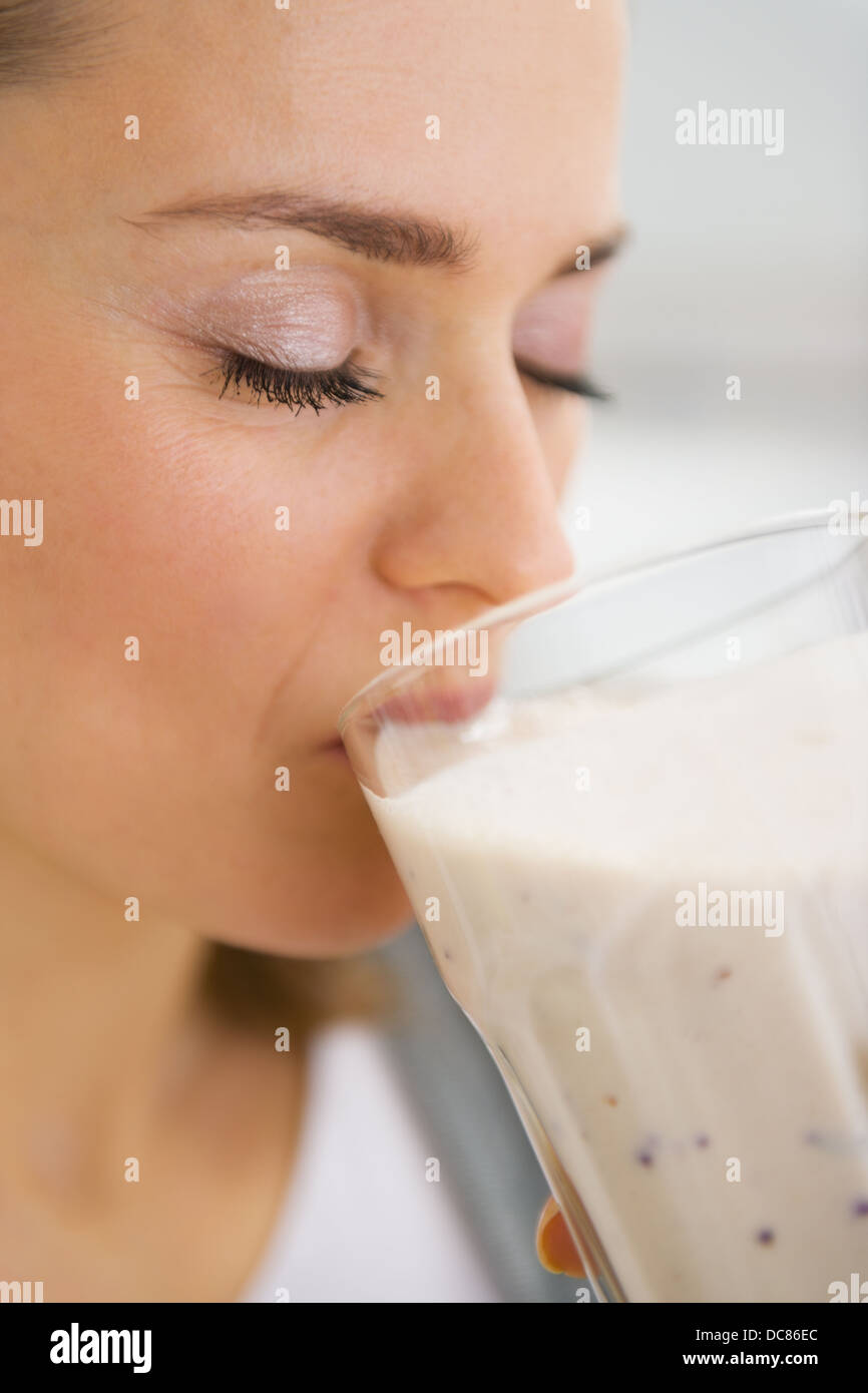 Young woman drinking cocktail Stock Photo - Alamy