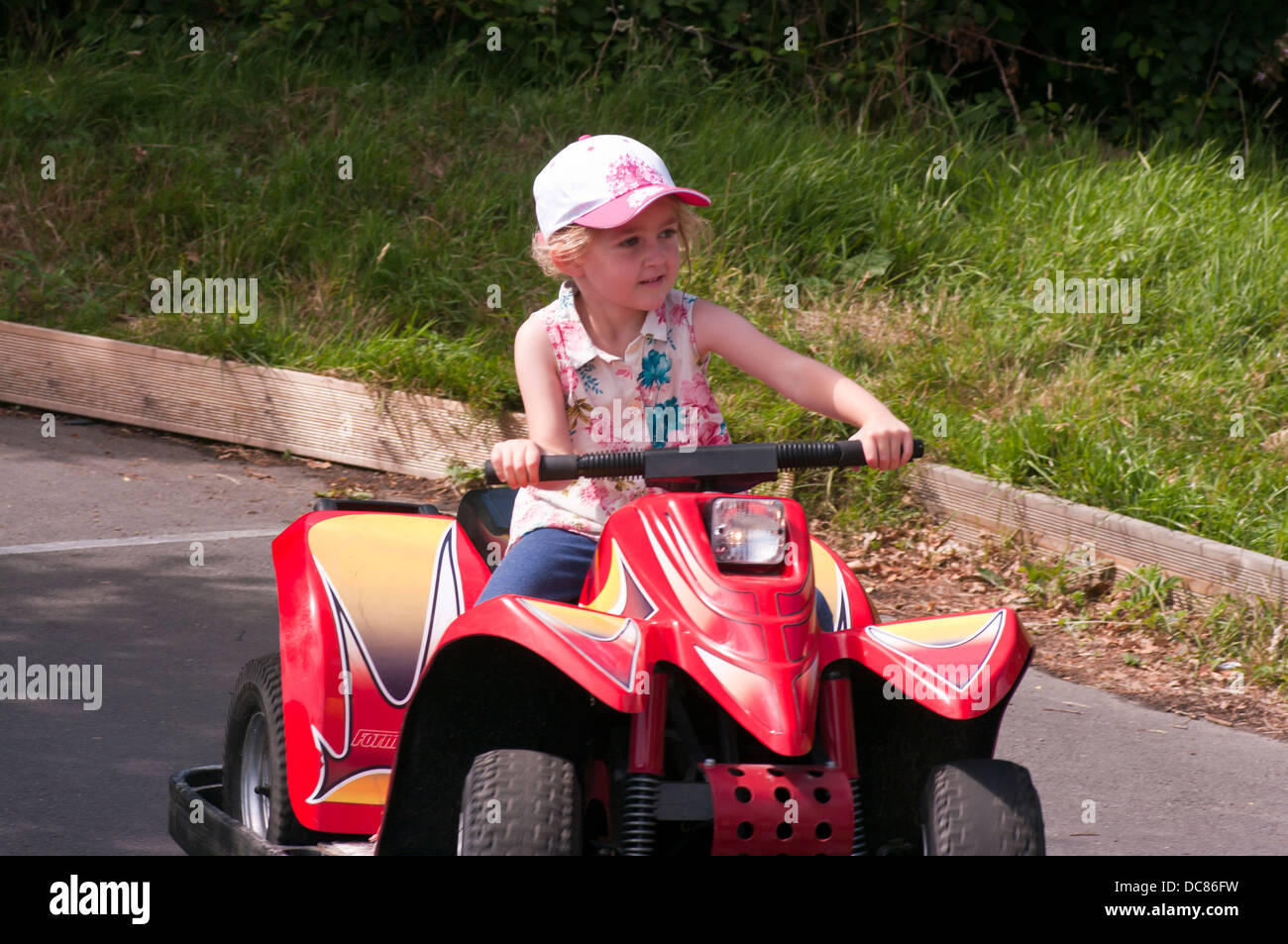 Little Girl Riding A Quad Bike Go Cart Stock Photo - Alamy