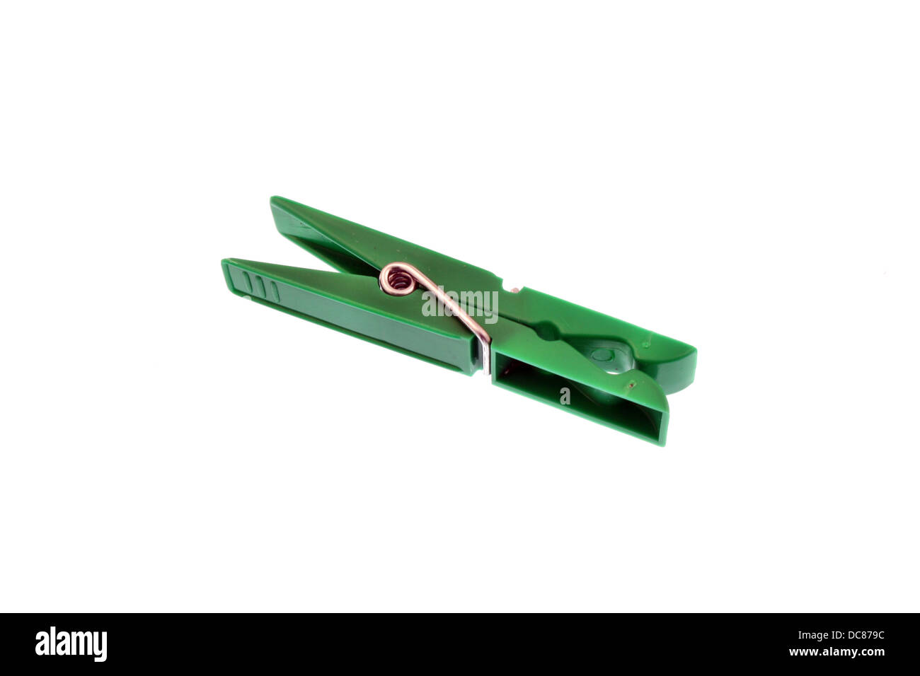 Green clothes peg on a white background Stock Photo - Alamy