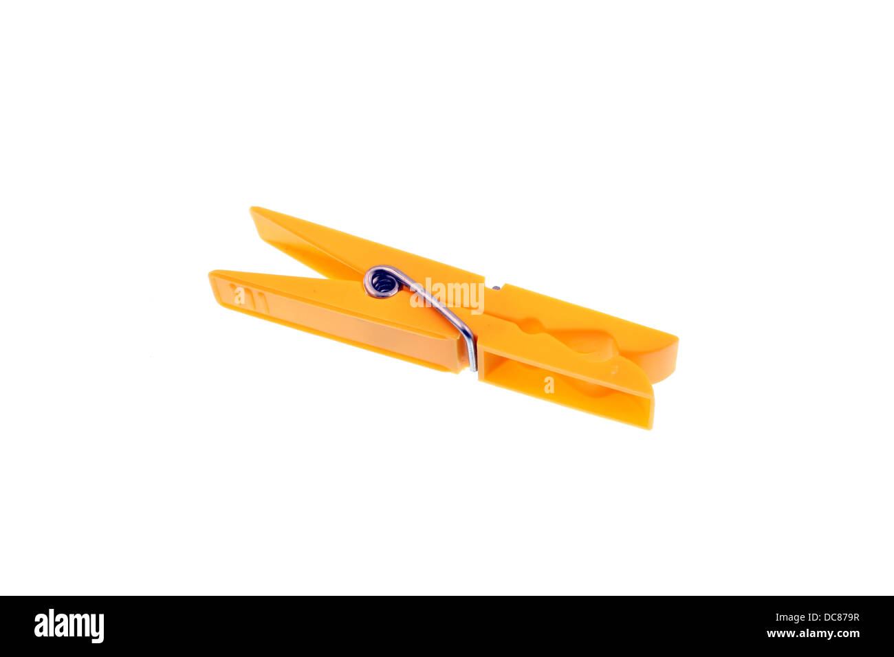 Yellow clothes peg on a white background Stock Photo - Alamy