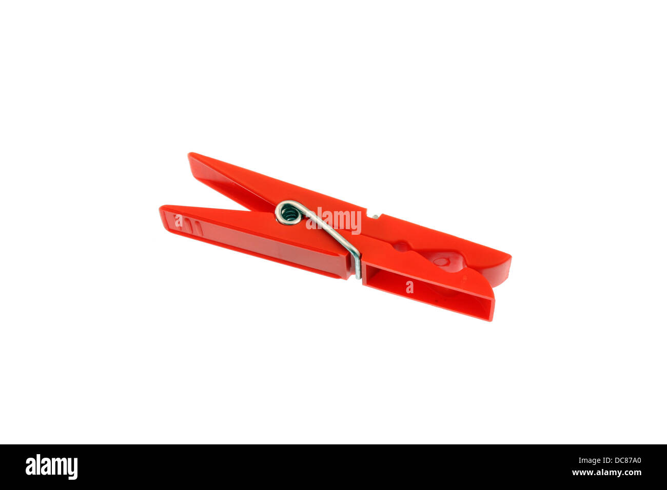 Red clothes peg on a white background Stock Photo - Alamy