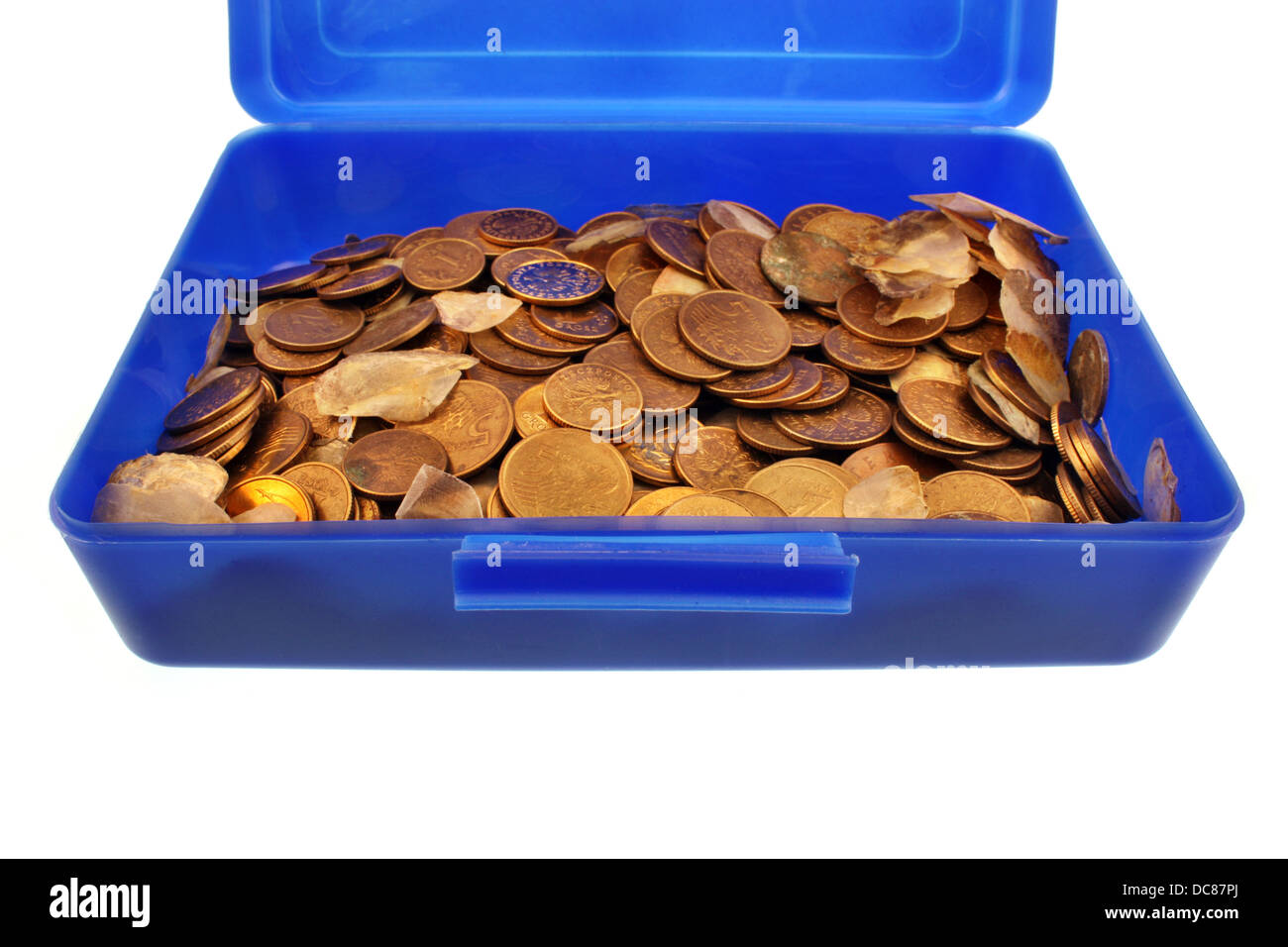 Money pennies and fortunately carp scales in the blue box isolated ...