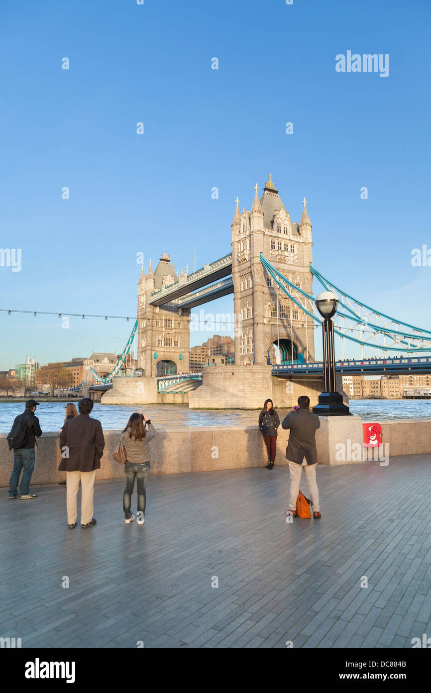 Tourists taking a picture at Tower bridge, London, England Stock Photo ...