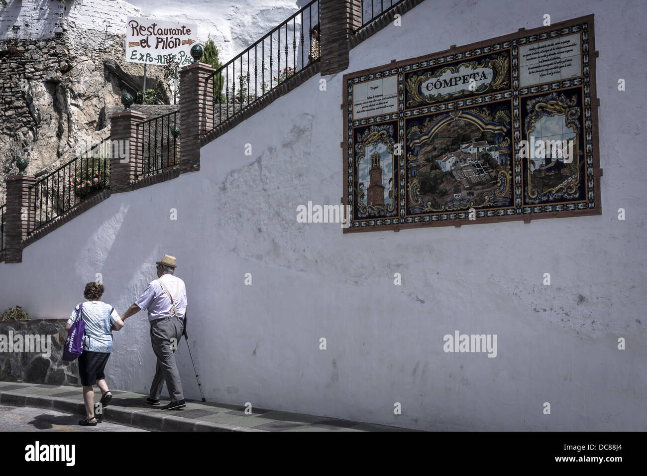 Residents walk past street hi-res stock photography and images - Alamy