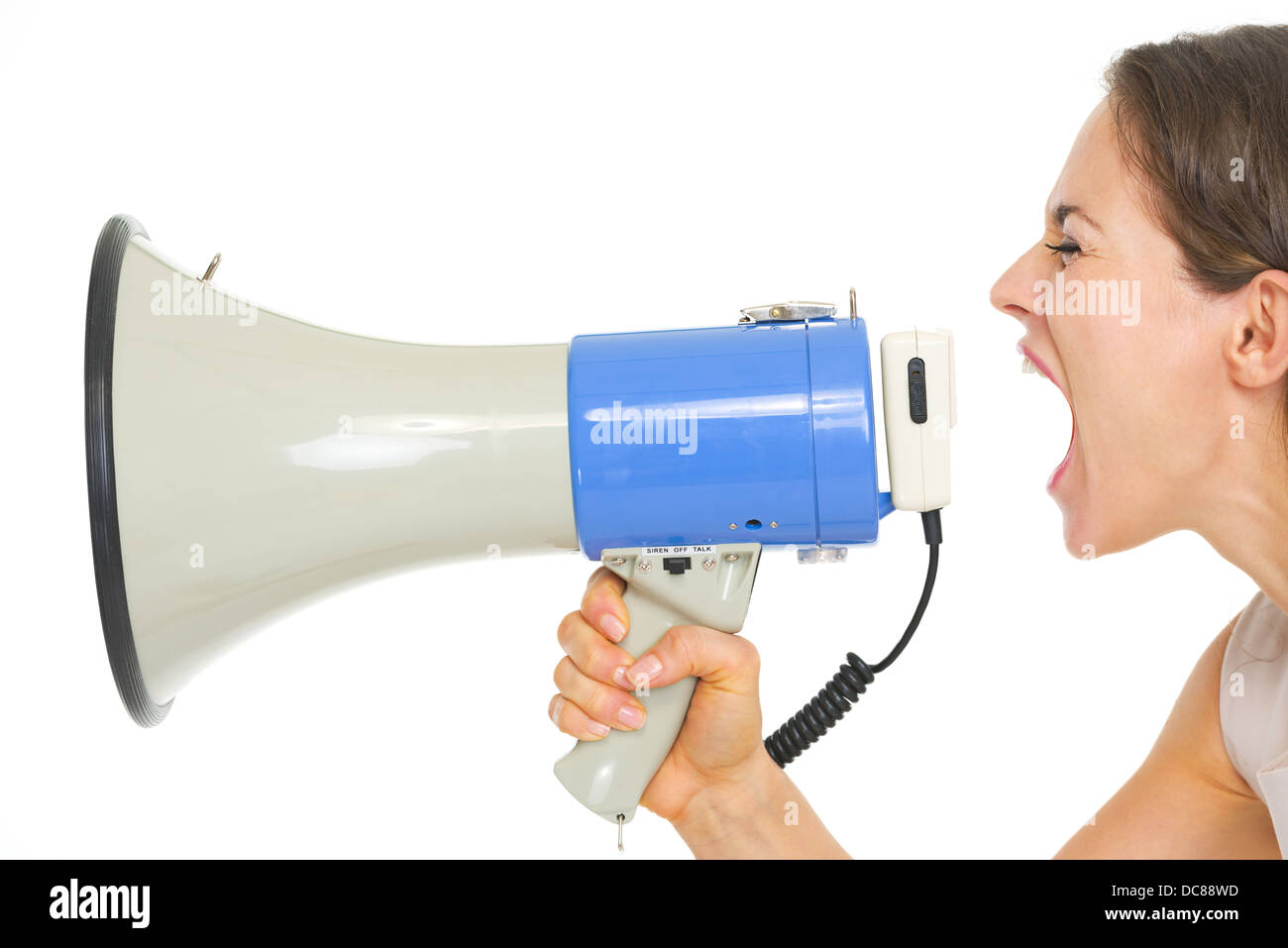 Young woman shouting through megaphone Stock Photo - Alamy