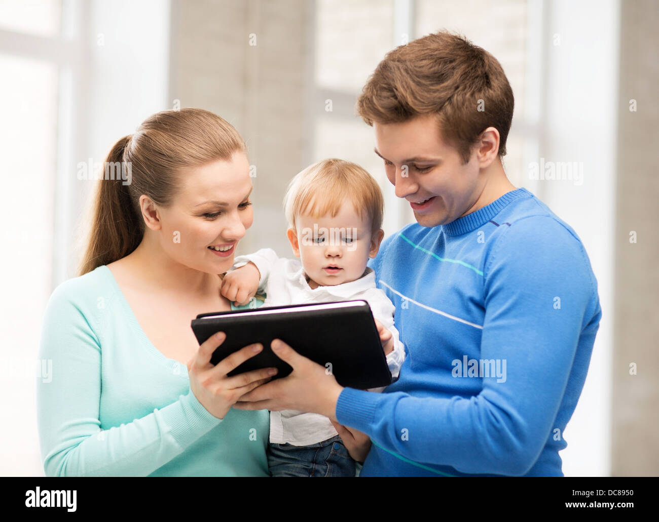 parents and adorable baby with tablet pc Stock Photo - Alamy