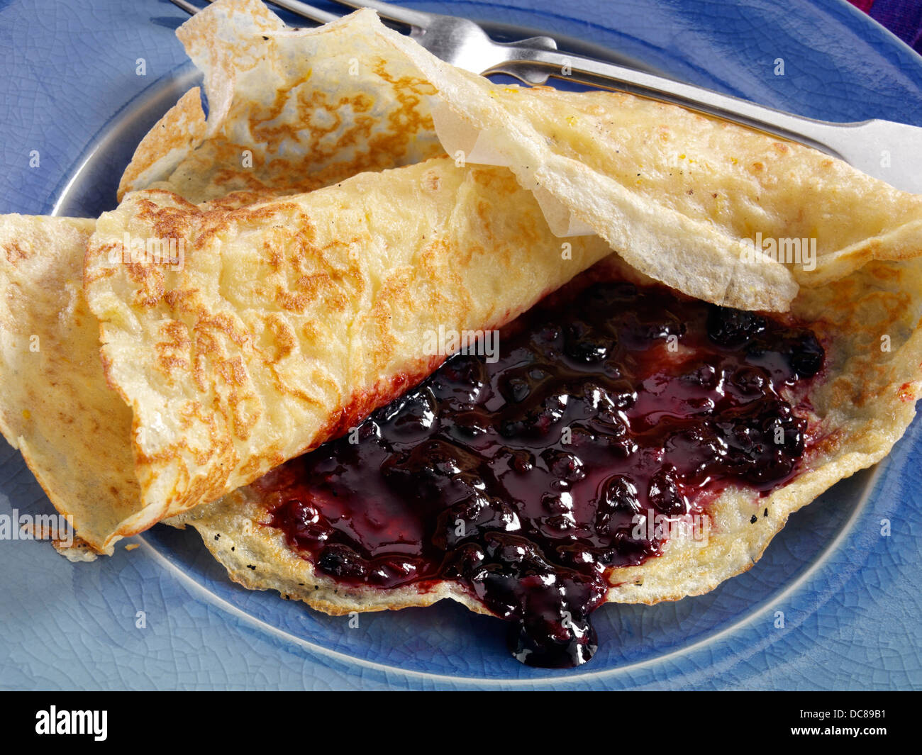 Crepes with blackberry jam Stock Photo - Alamy