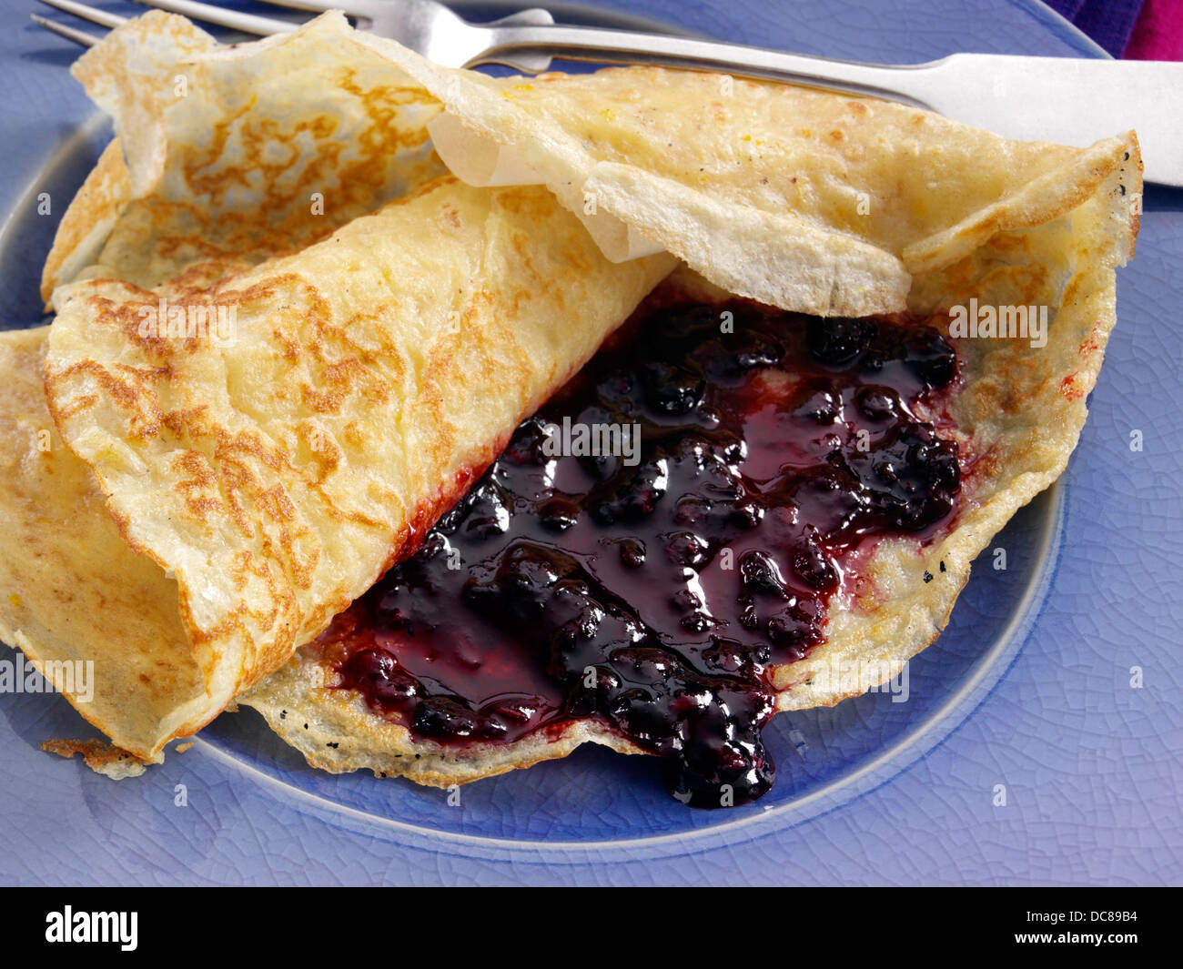 Crepes with blackberry jam Stock Photo - Alamy