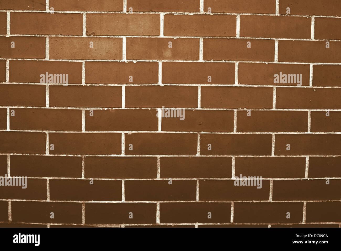 Brown brick brown stone wall Stock Photo - Alamy