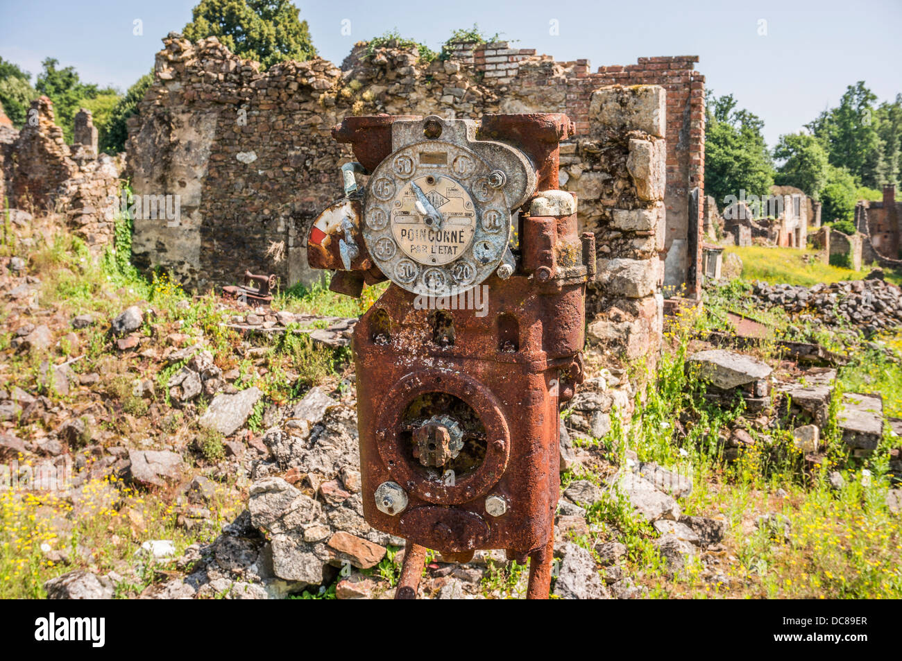 A rusty portable petrol pump, in the ruins of Oradour-sur-Glane village ...