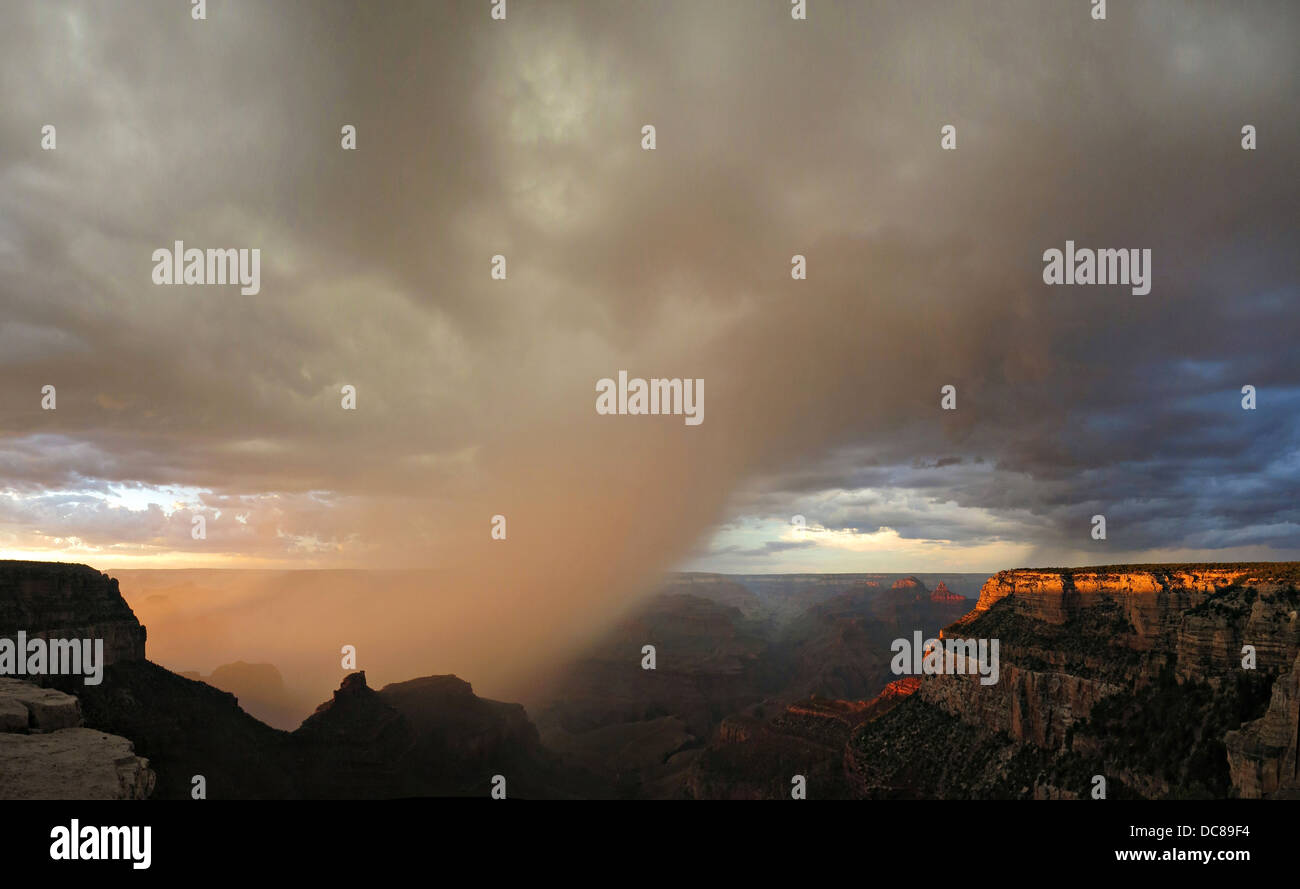 The last rays of sunlight illuminate rain falling inside the Grand ...