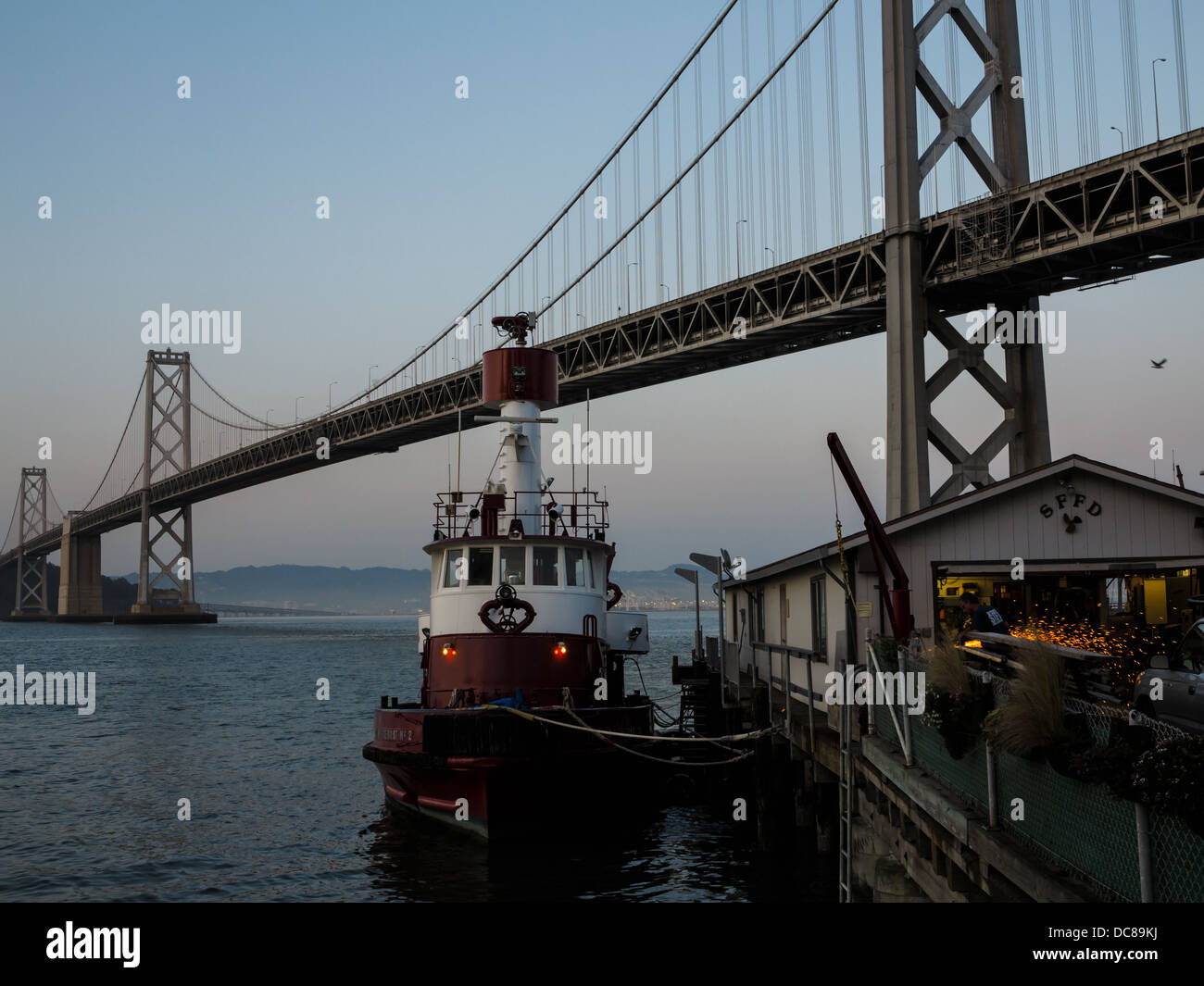 Fire boat moored along side city fire station in San Francisco Bay at ...