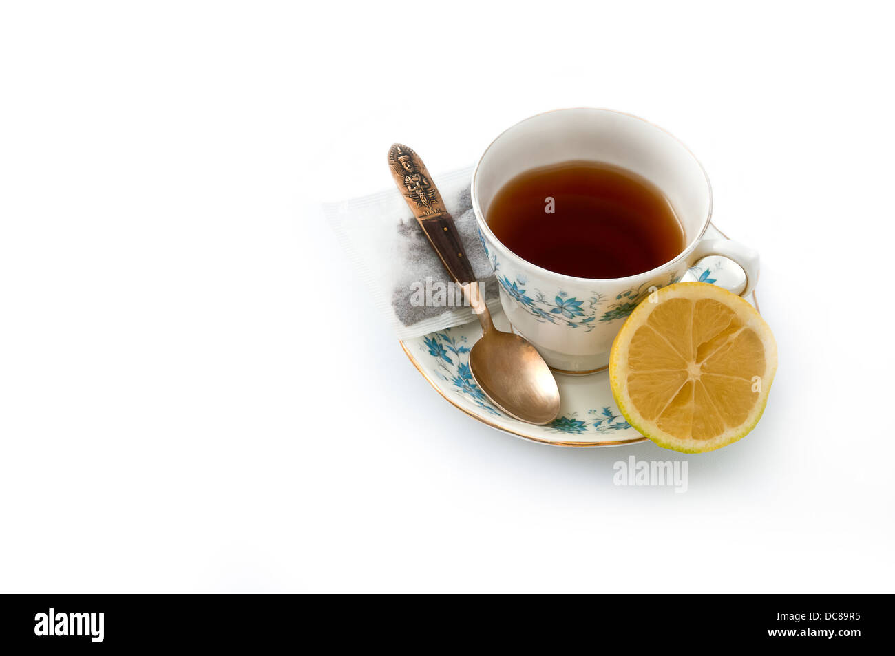 Tea cup china with lemon and spoon white background Stock Photo - Alamy