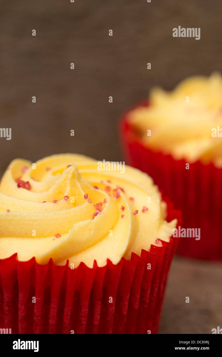Frosted cupcakes on rustic background Stock Photo - Alamy