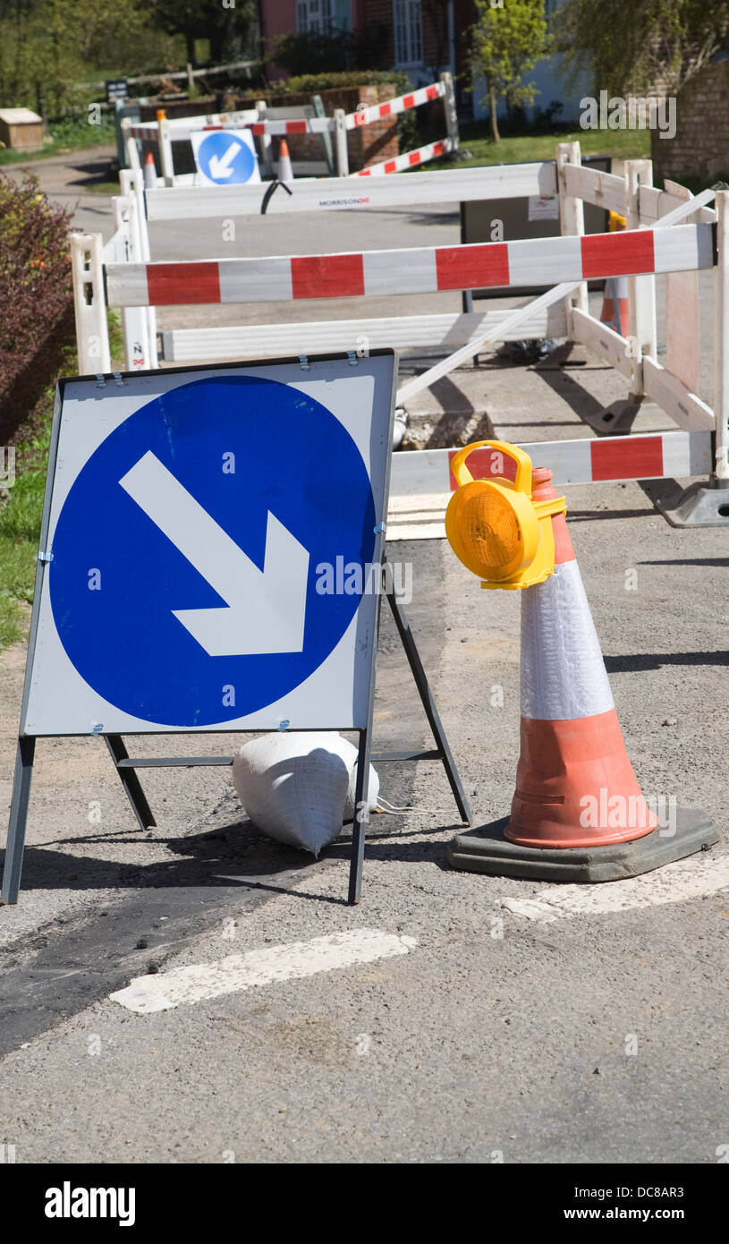 Blue direction arrow road sign at roadworks, Suffolk, England Stock ...