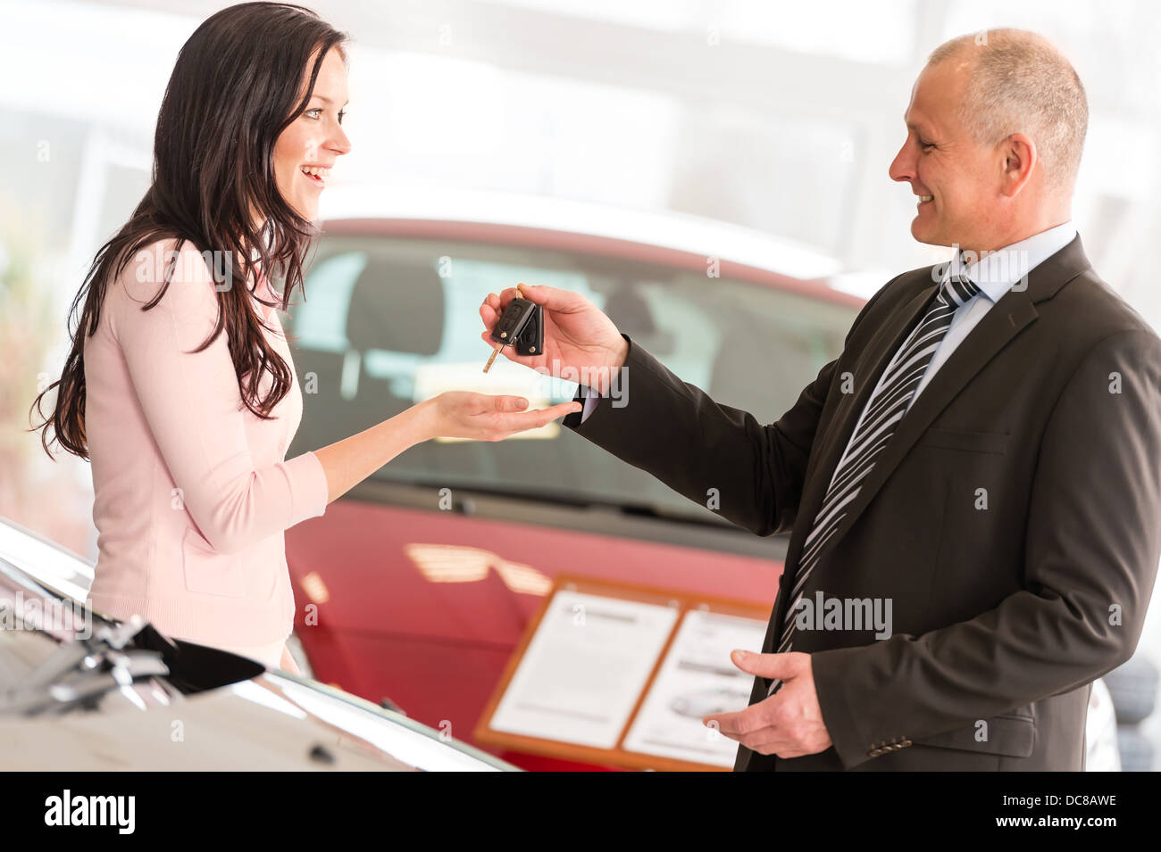 Woman receiving keys new hi-res stock photography and images - Alamy