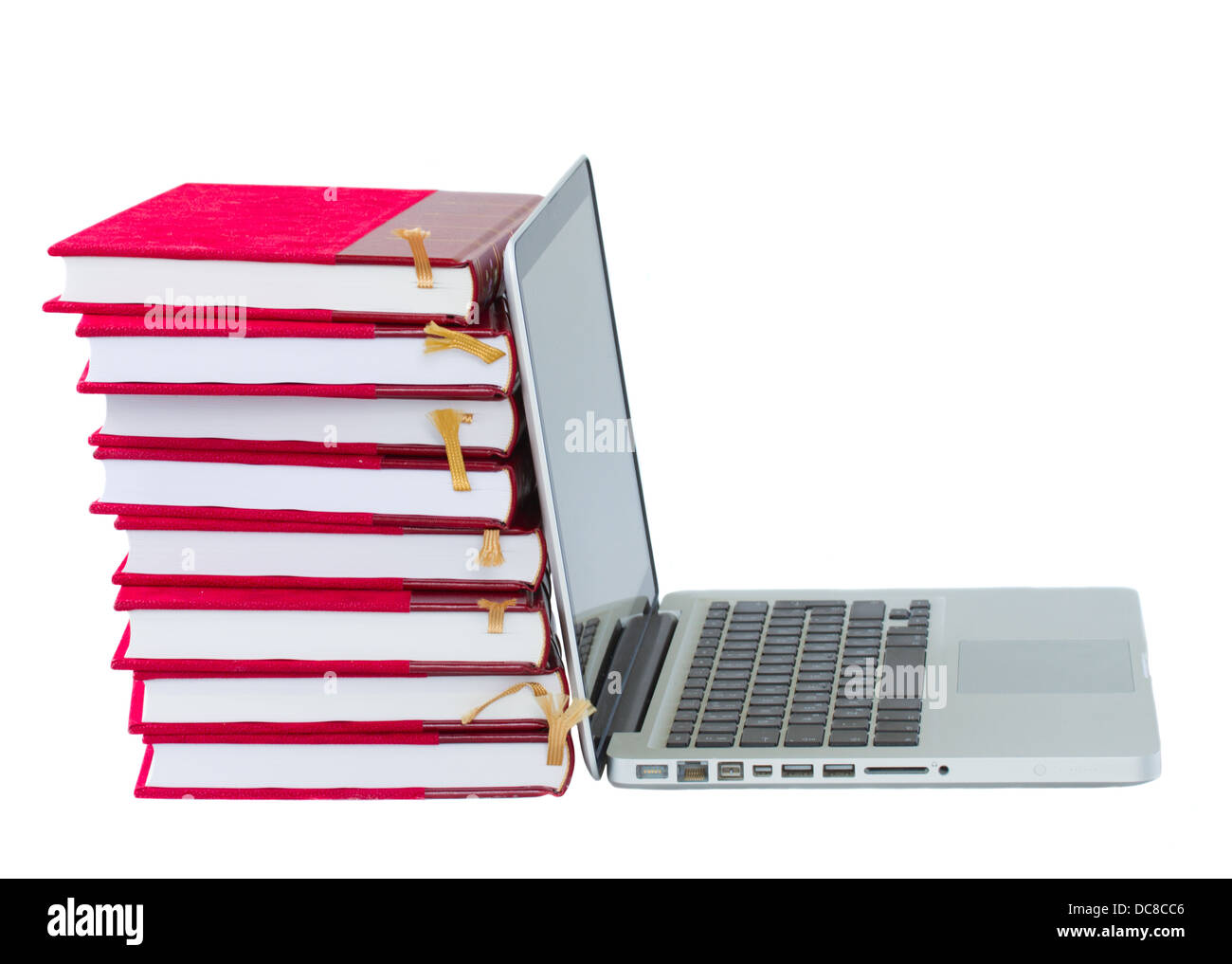 Reading laptop and book Cut Out Stock Images & Pictures - Alamy