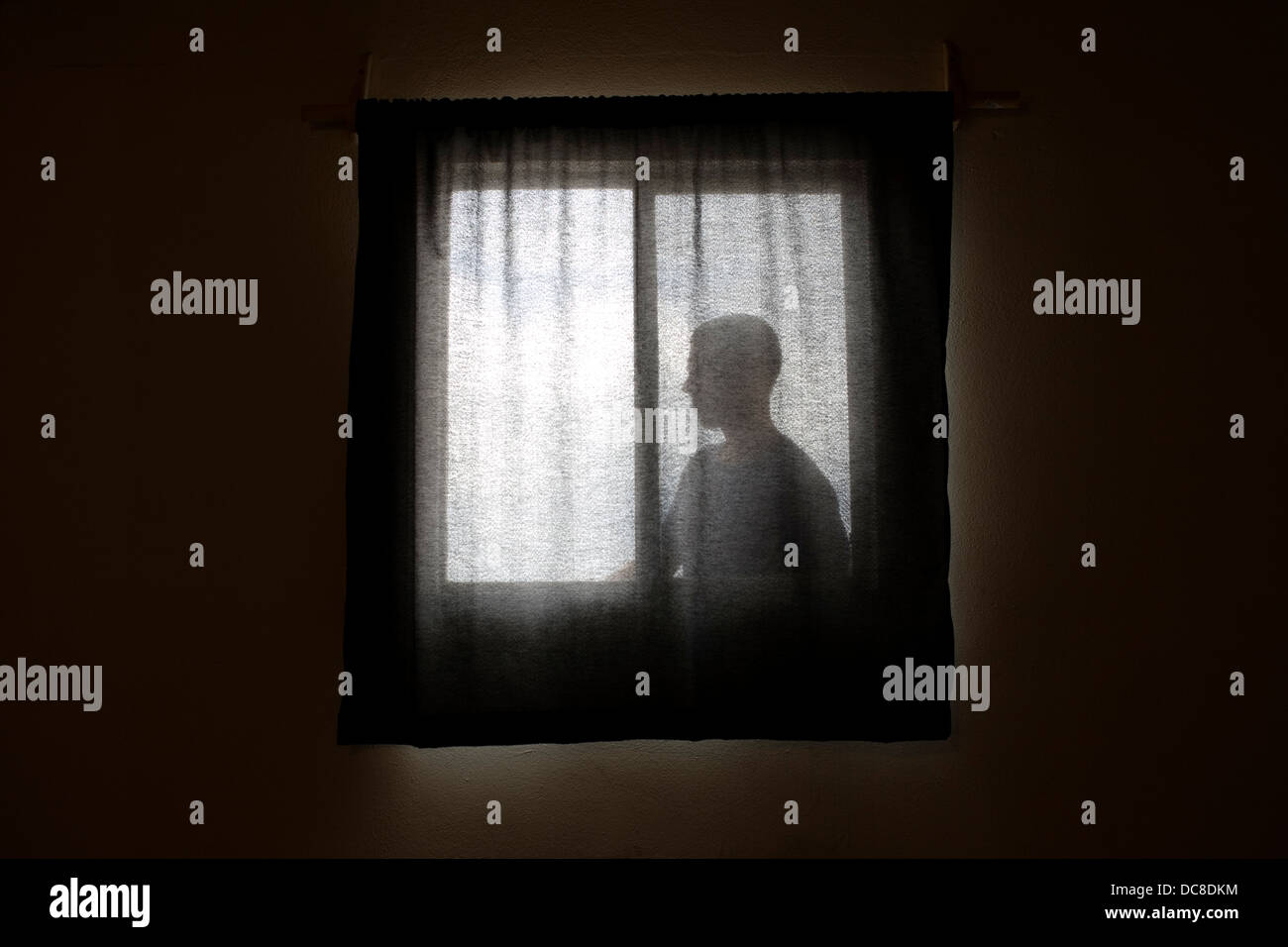 A man looking in through the window Stock Photo - Alamy