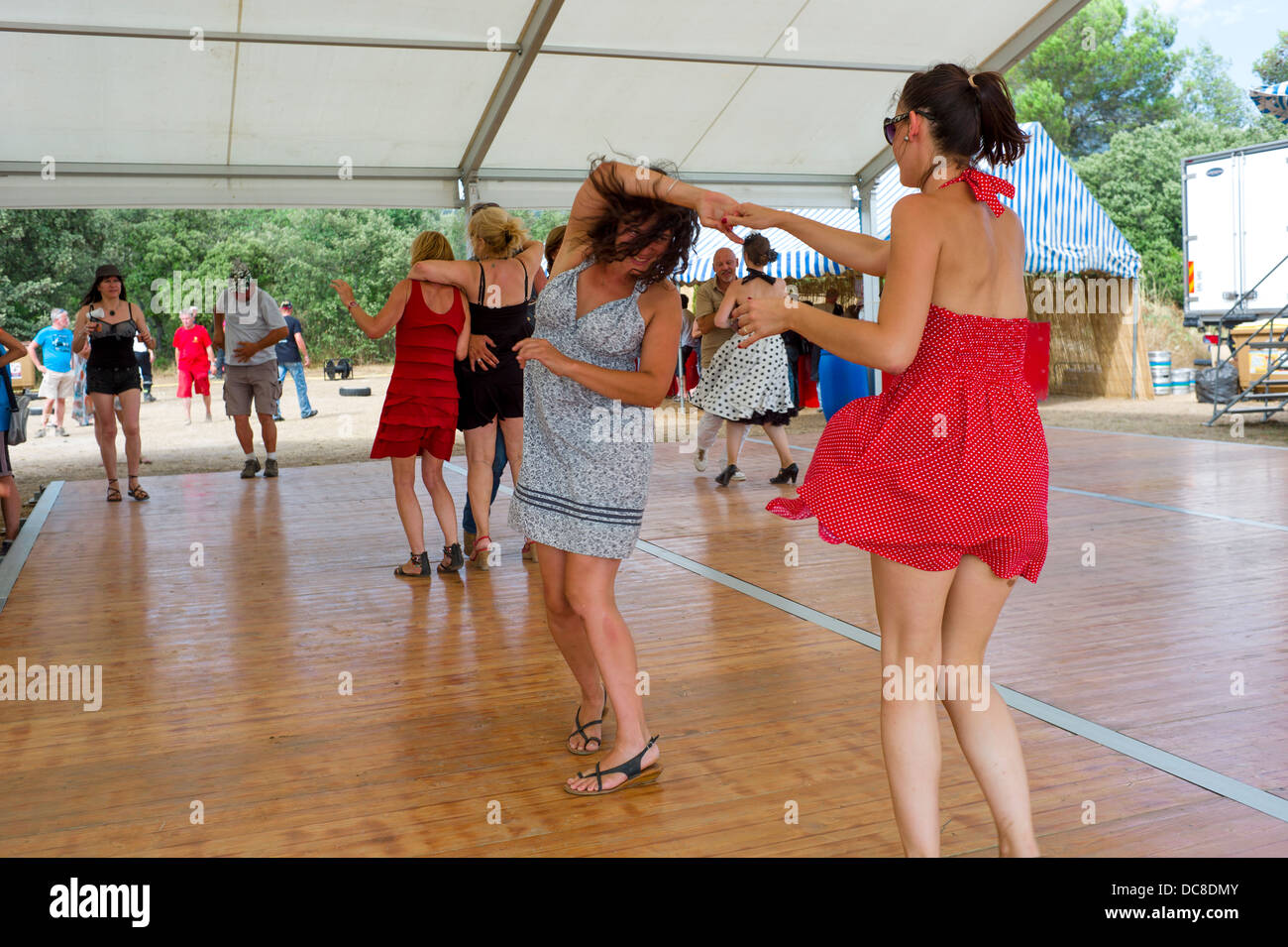 Couples dancing at a motor and motor cycle show in Provence France ...