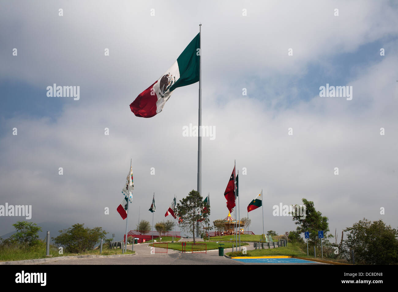 The Mexican national flag flying alongside an assortment of regional ...