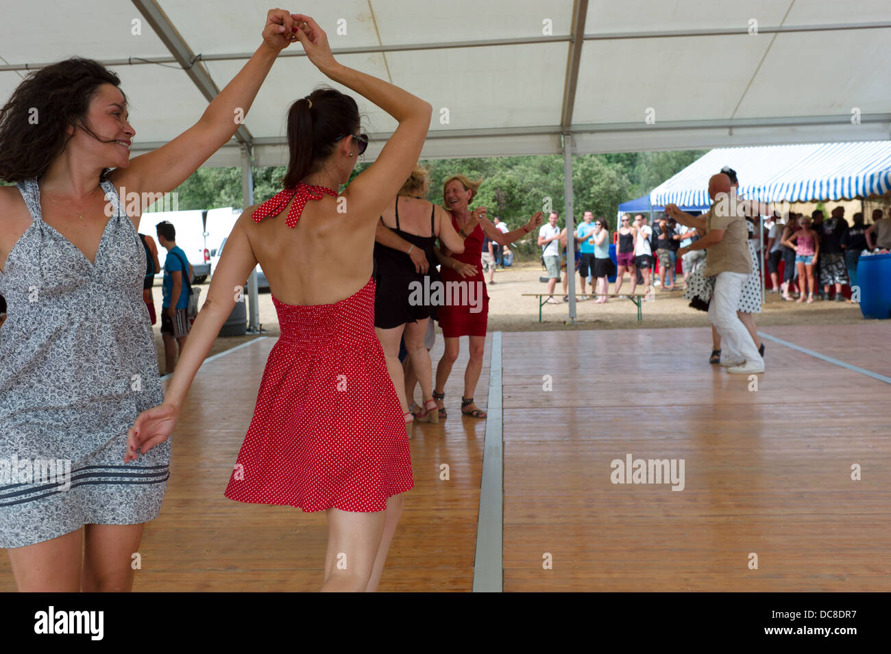 Couples dancing at a motor and motor cycle show in Provence France ...