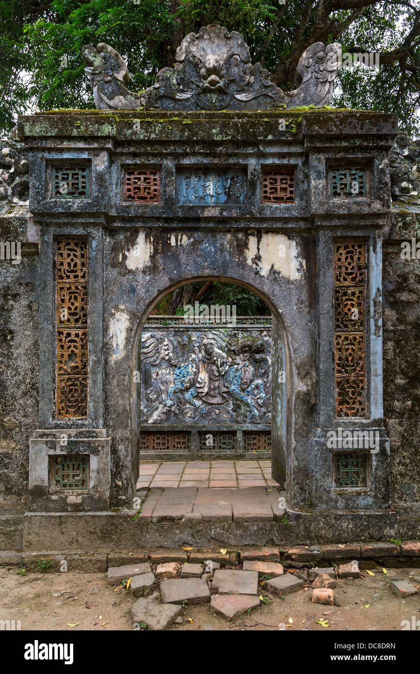 A rustic weathered gate at the Tu Duc Emperors tomb near Hue, Vietnam ...