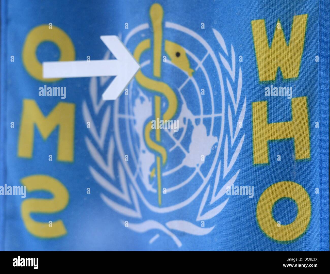 The flag of the World Health Organization WHO is photographed in ...