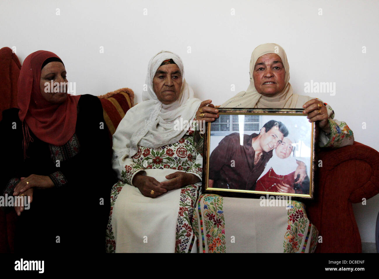 Ramallah, West Bank, Palestinian Territory. 12th Aug, 2013. Ne'ma Mansour, the mother of Esmat ...