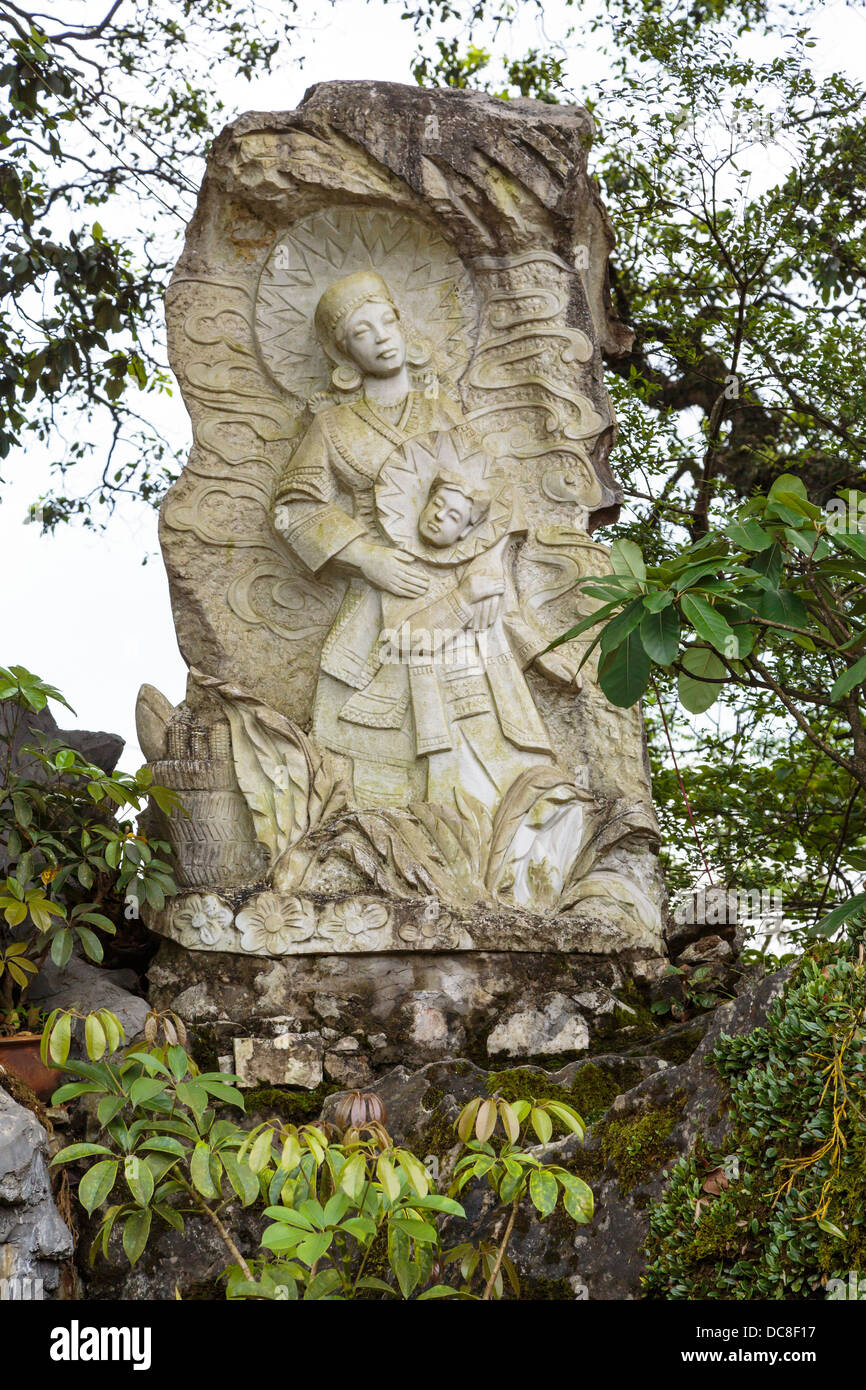 Tomb of the priest and grotto at the Nam Duc Tin Catholic church in ...