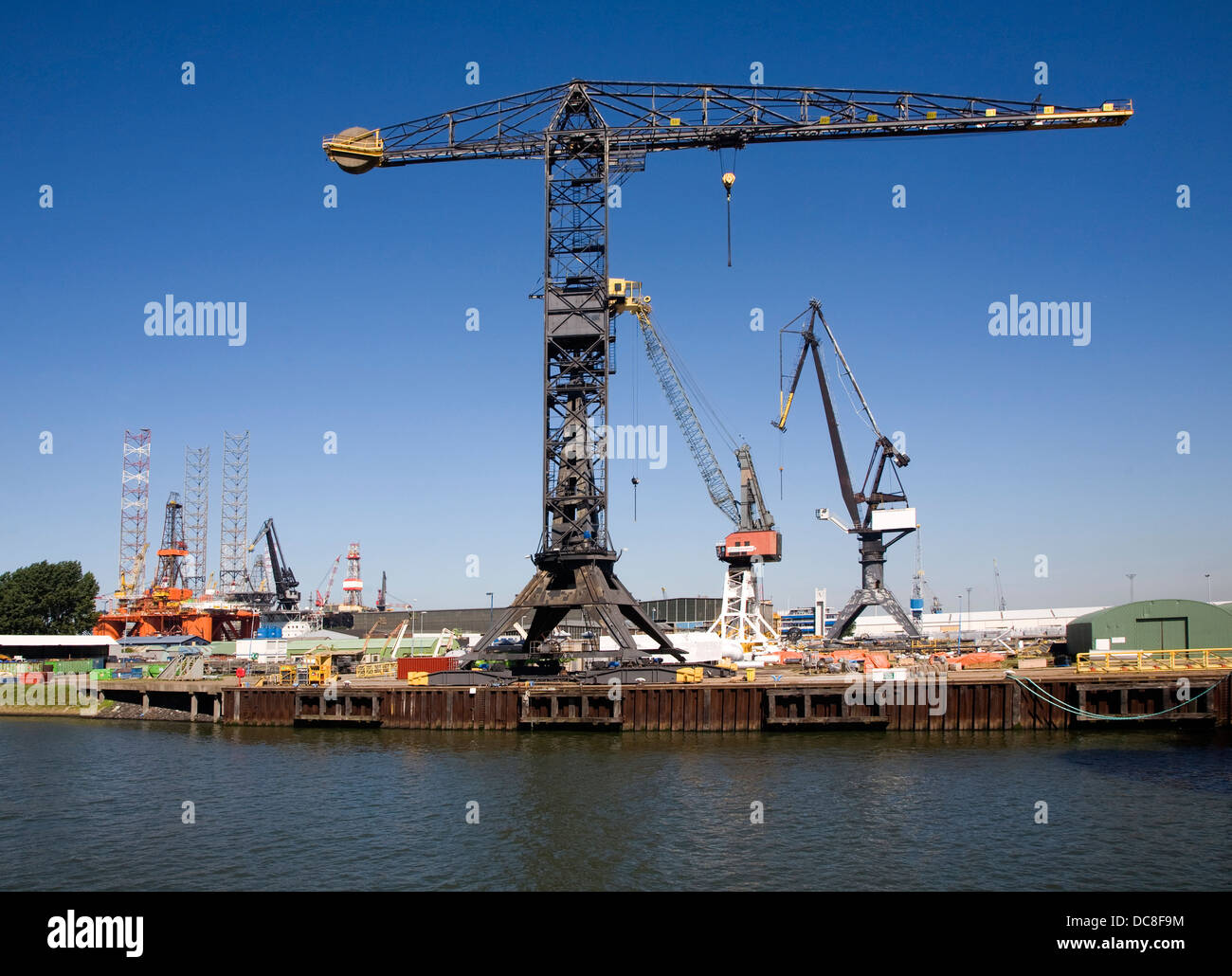 Cranes of different types and size Port of Rotterdam, Netherlands Stock ...