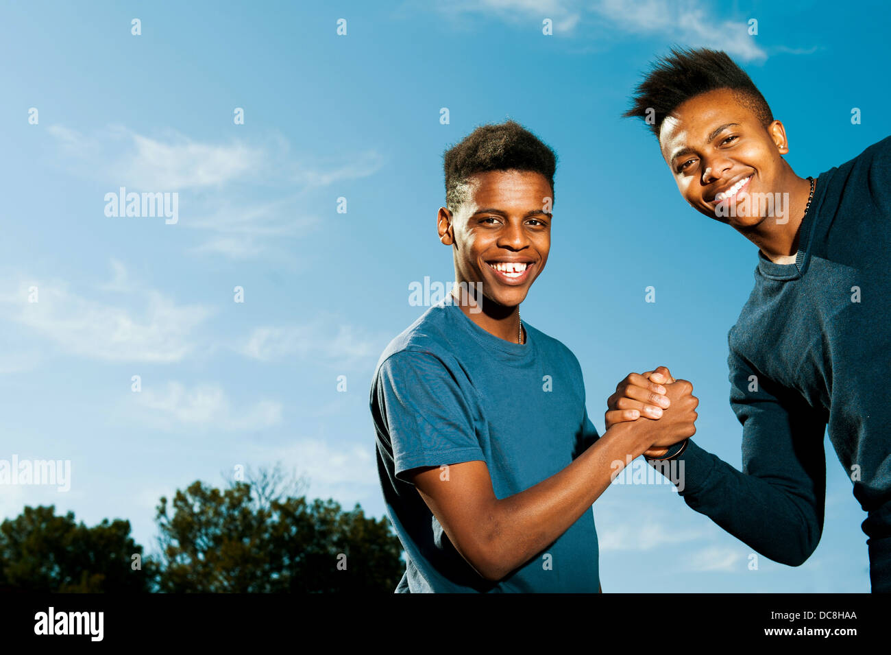 Young friends greeting each other Stock Photo - Alamy
